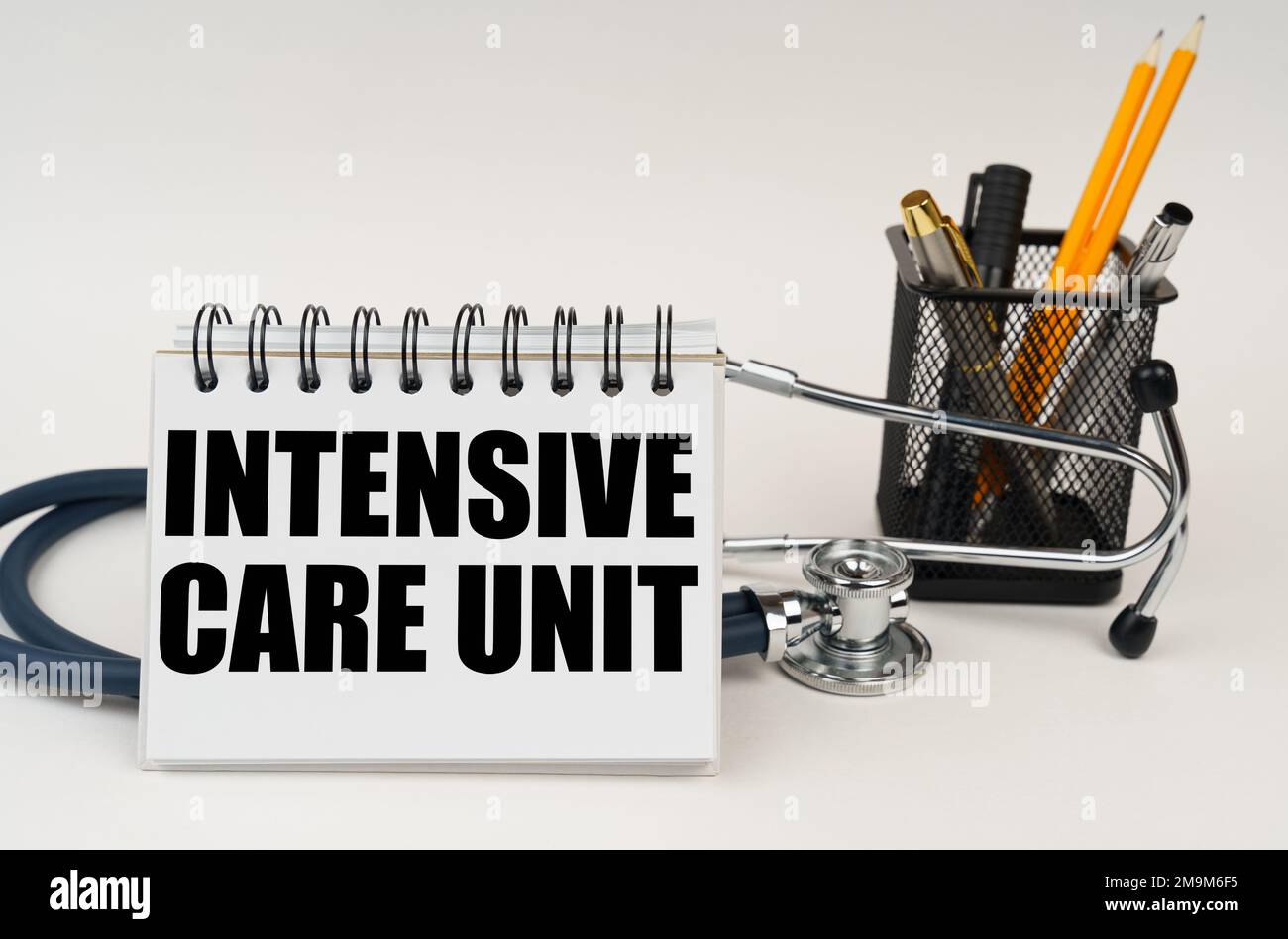 Medical concept. On the table are office supplies, a stethoscope and a ...