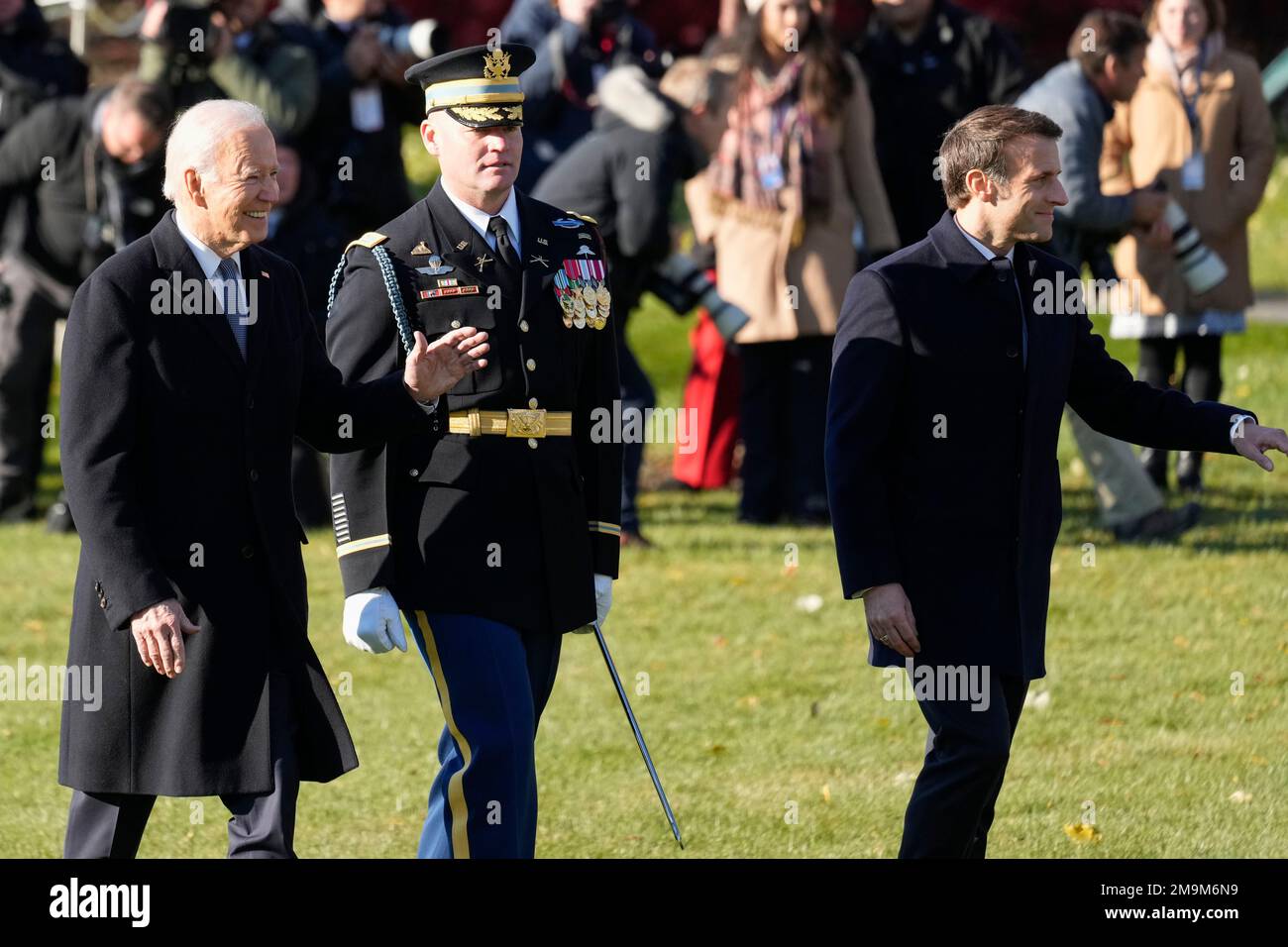 President Joe Biden and French President Emmanuel Macron review the ...