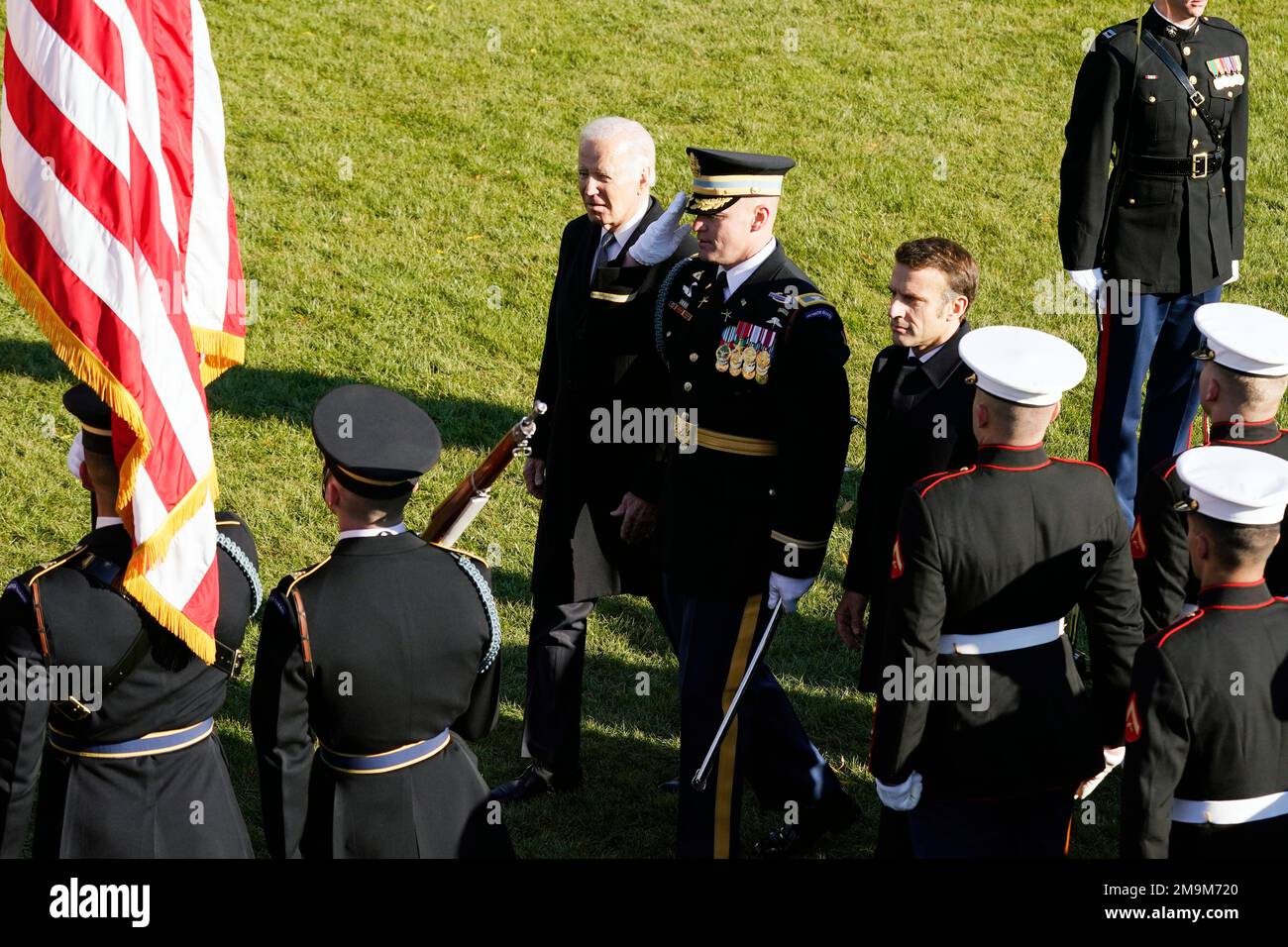 President Joe Biden and French President Emmanuel Macron review the ...