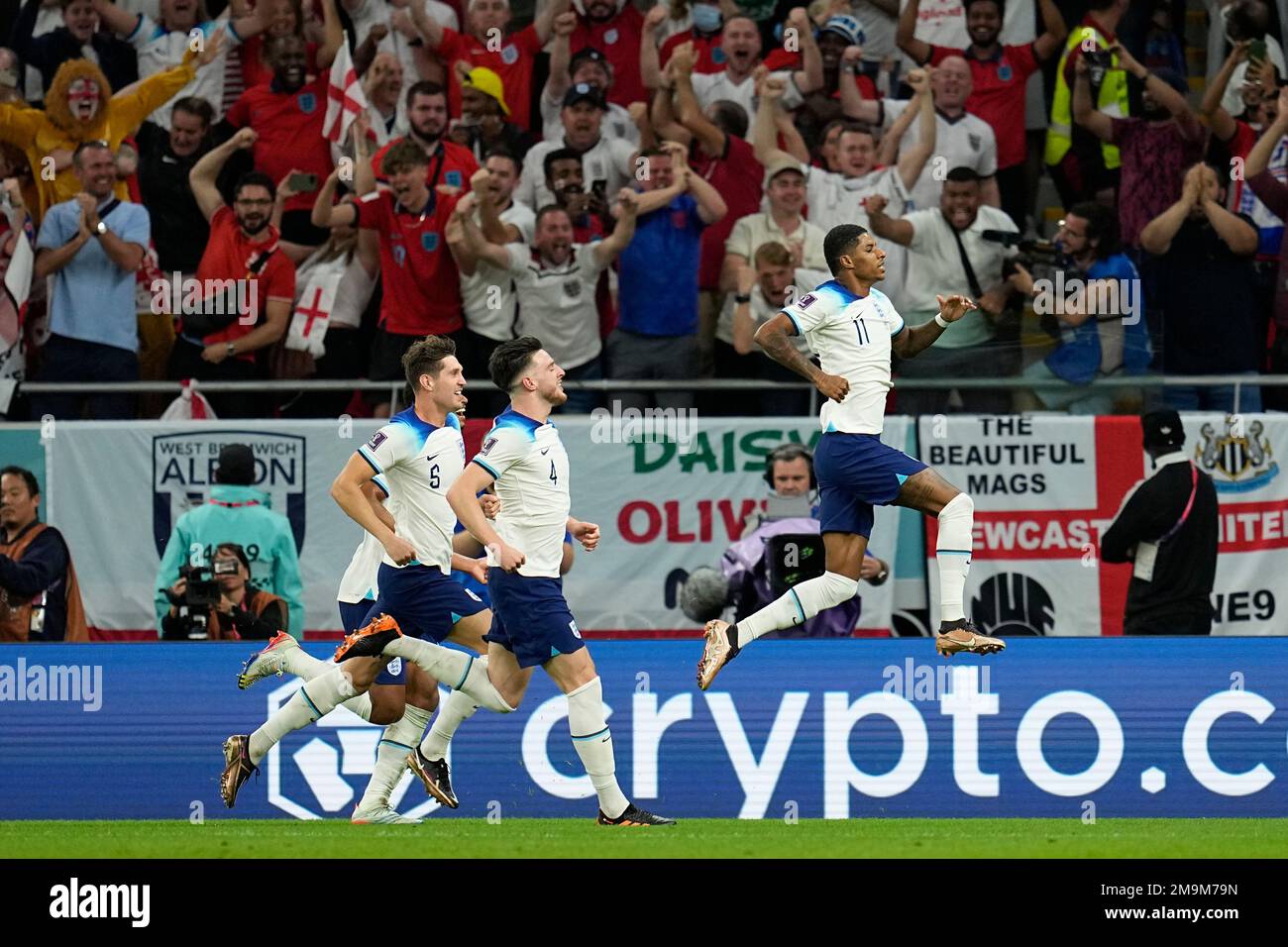 England's Marcus Rashford, right, celebrates after scoring during the ...