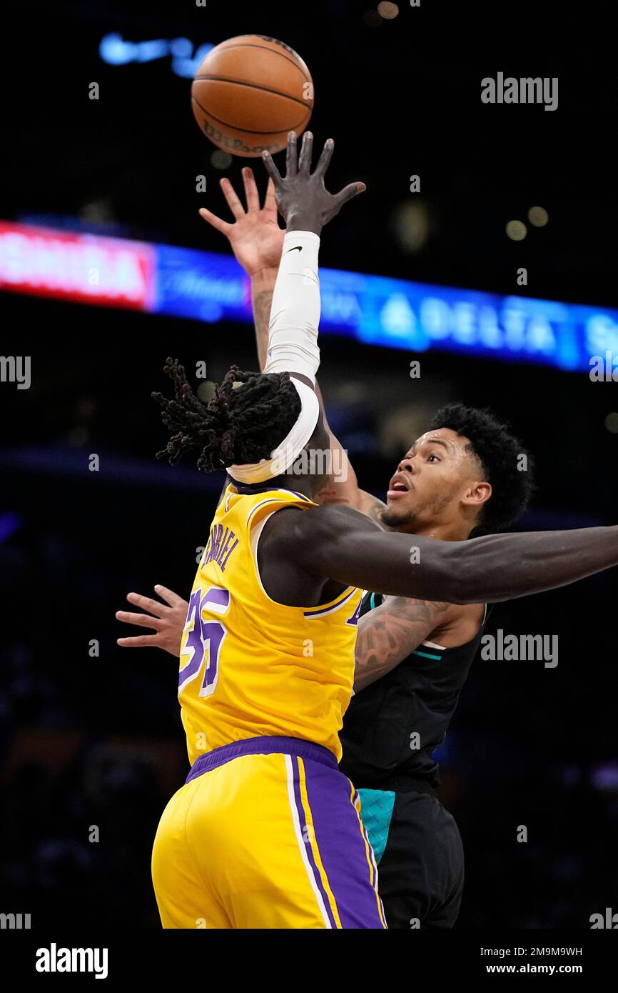 Portland Trail Blazers guard Anfernee Simons, right, shoots as Los ...