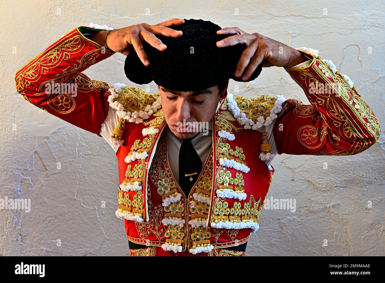 Bullfighter Jesus Colombo adjusts his "montera" before entering the ...