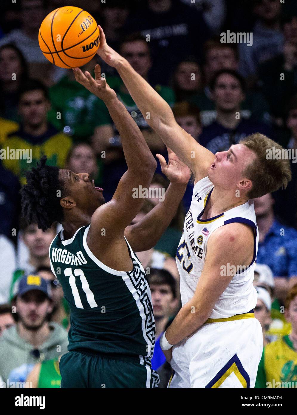 Notre Dame's Dane Goodwin, right, blocks a shot by Michigan State's A.J ...