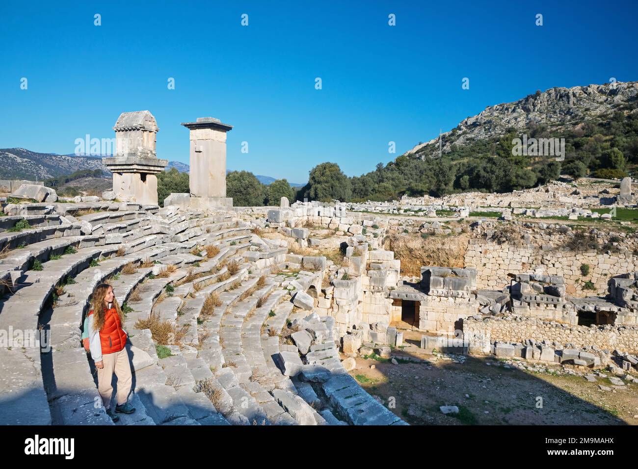 Woman looking at theater of Xanthos ancient city - part of Lycian way ...