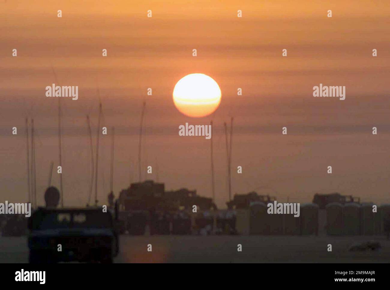 The Sun rises illuminating the dispersal area of the US Marine Corps ...