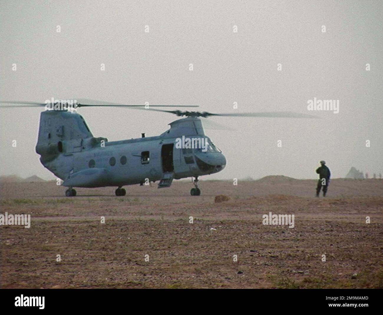 A US Marines (USMC) CH-46 Sea Knight turns rotors for a function check ...