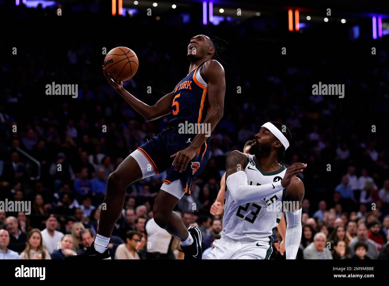 New York Knicks guard Immanuel Quickley (5) drives to the basket past ...