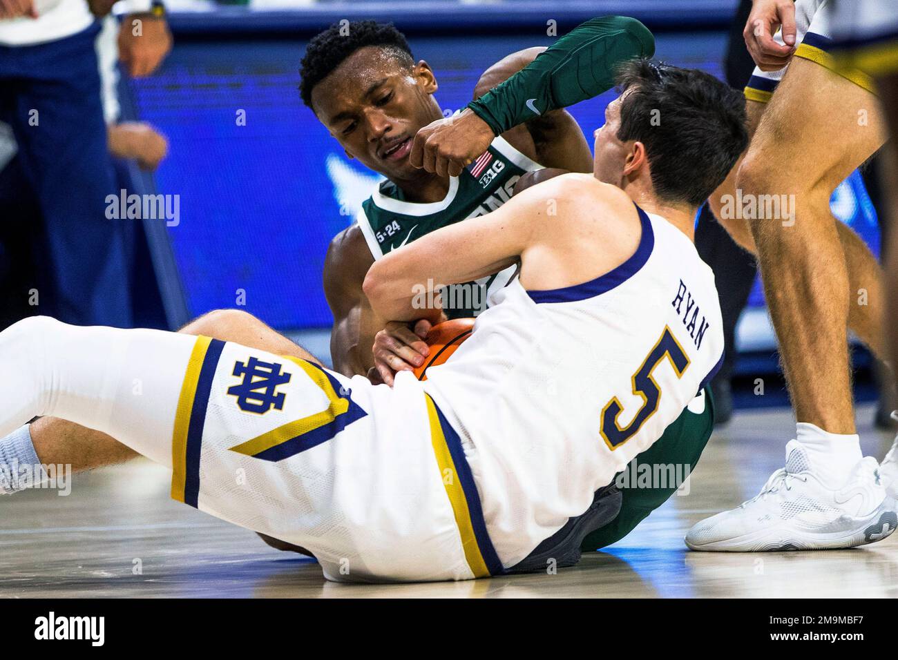 Michigan State's Tyson Walker, rear, and Notre Dame's Cormac Ryan ...