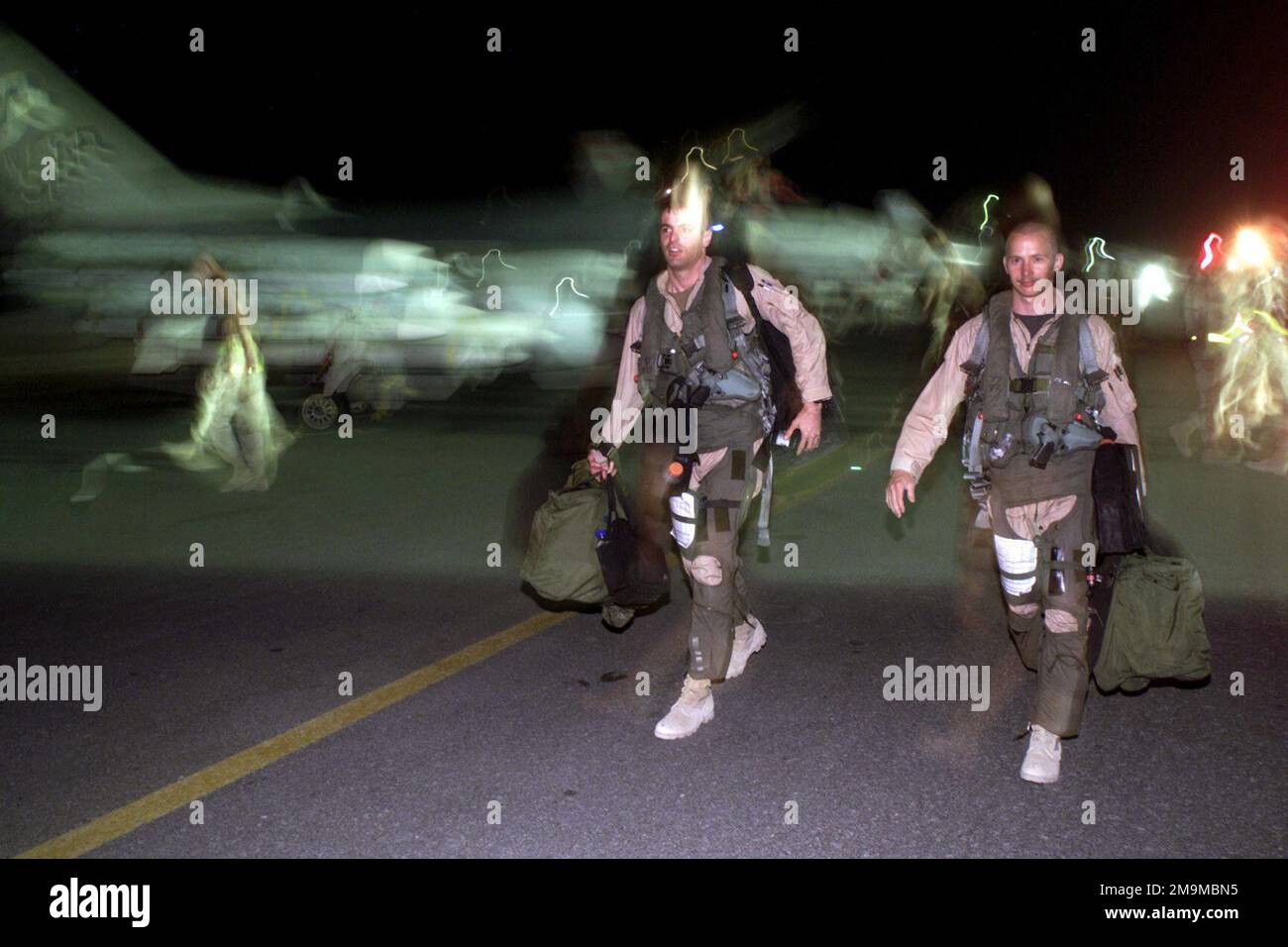 A couple of pilots call sign "Lude"(left) and "Lobo" depart the ...