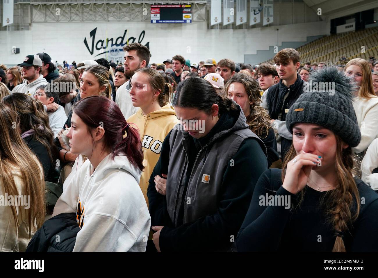 People attending a vigil for the four University of Idaho students who ...