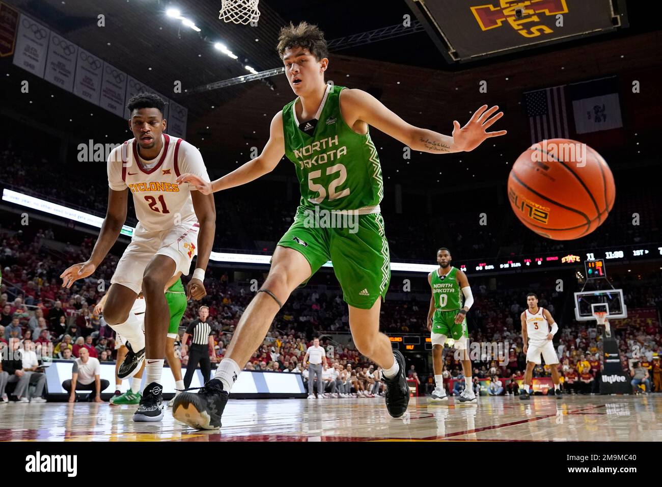 North Dakota guard Treysen Eaglestaff (52) fights for a loose ball with ...