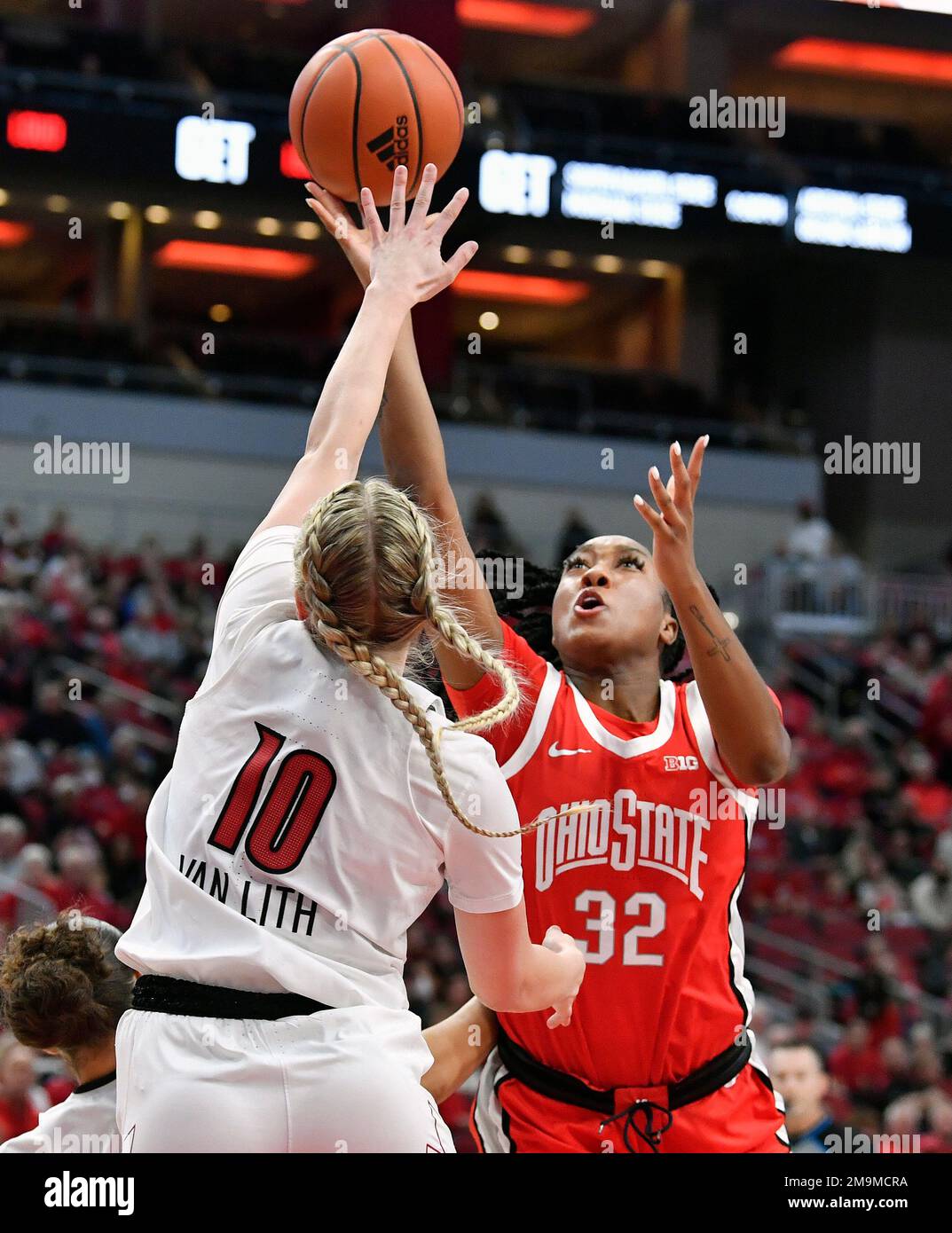 Ohio State forward Cotie McMahon (32) shoots over Louisville guard ...