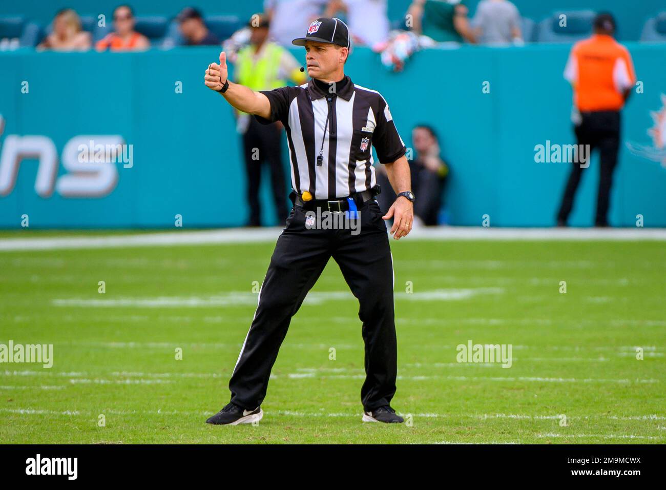 NFL back judge Steve Patrick gestures on the field during an NFL ...