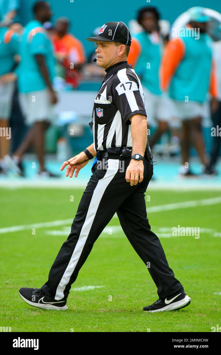 NFL back judge Steve Patrick walks on the field during an NFL football ...