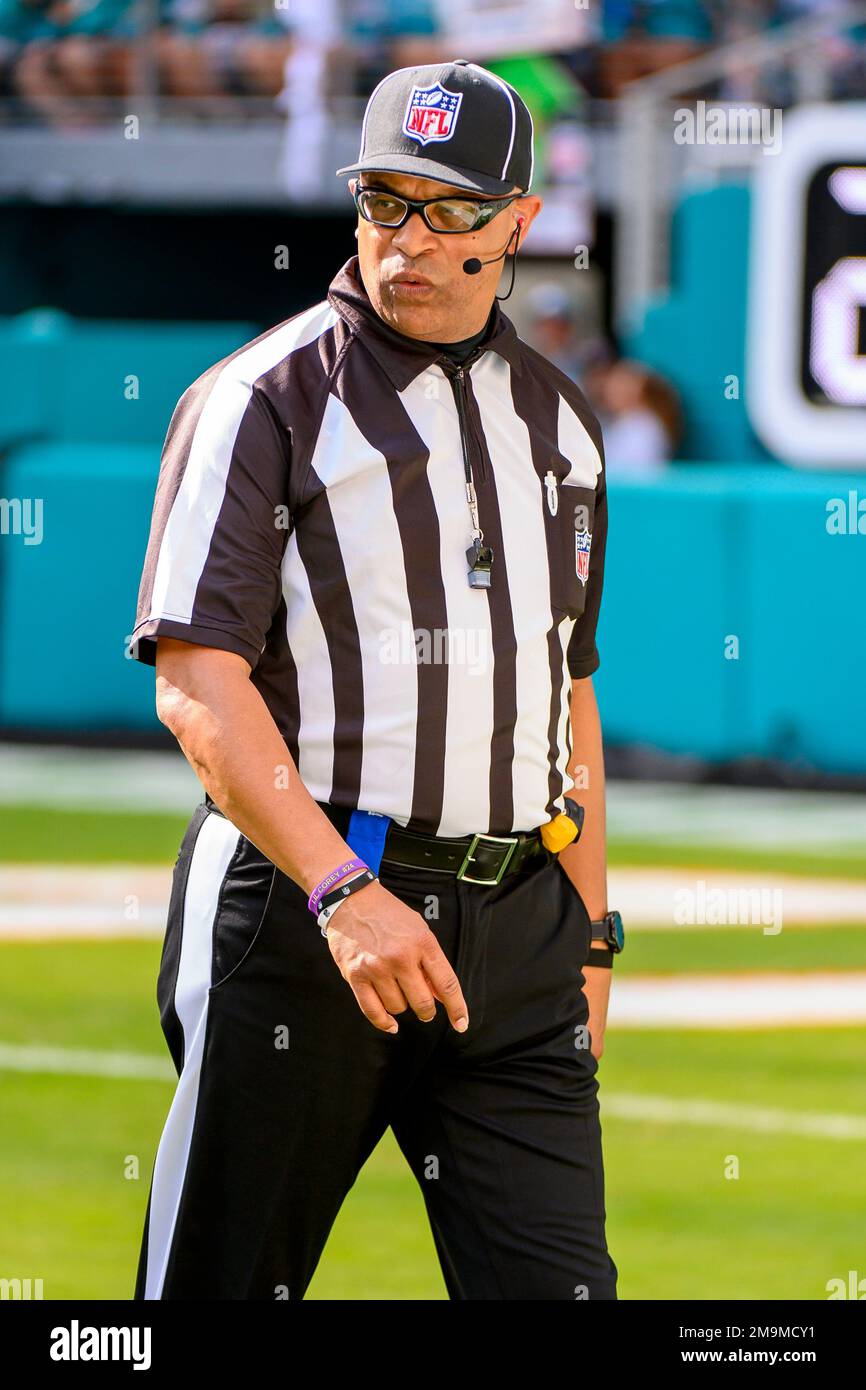 NFL down judge Frank LeBlanc walks on the field during an NFL football ...