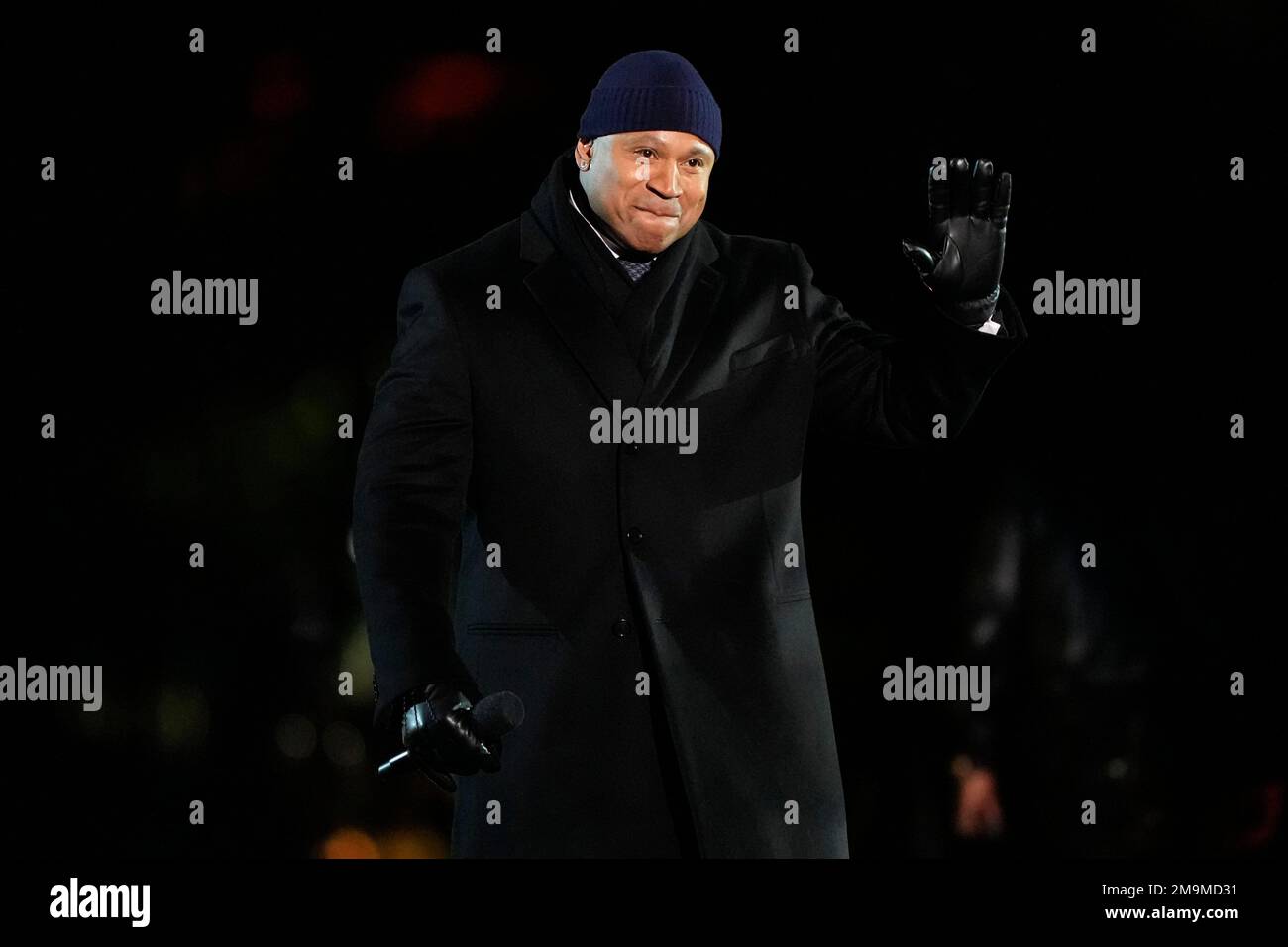 Singer and actor LL Cool J waves on stage before President Joe Biden ...