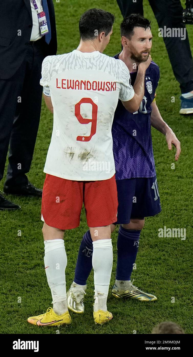 Poland's Robert Lewandowski, left, interacts with Argentina's Lionel ...