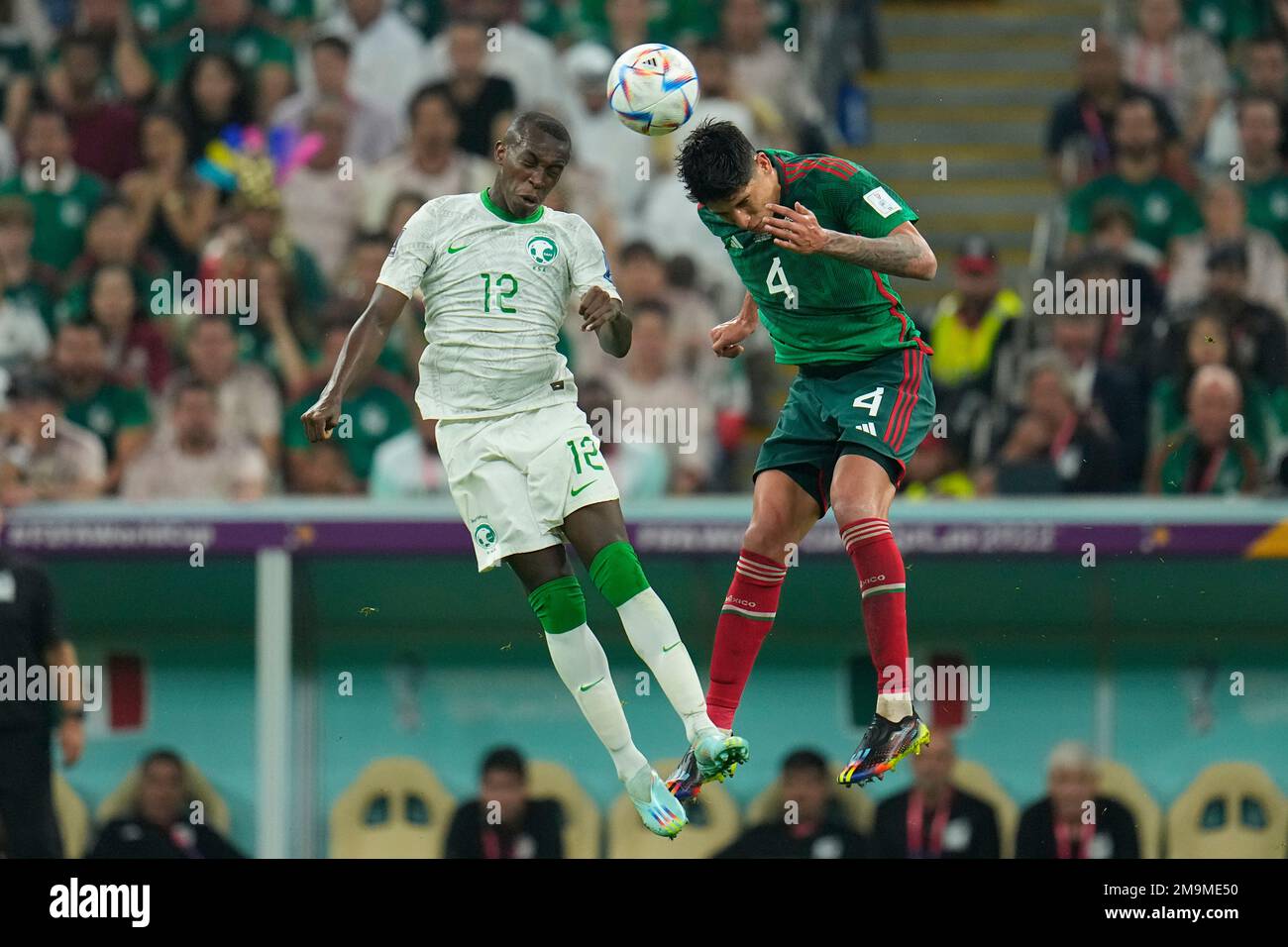 Saudi Arabia's Saud Abdulhamid, left, and Mexico's Edson Alvarez head ...