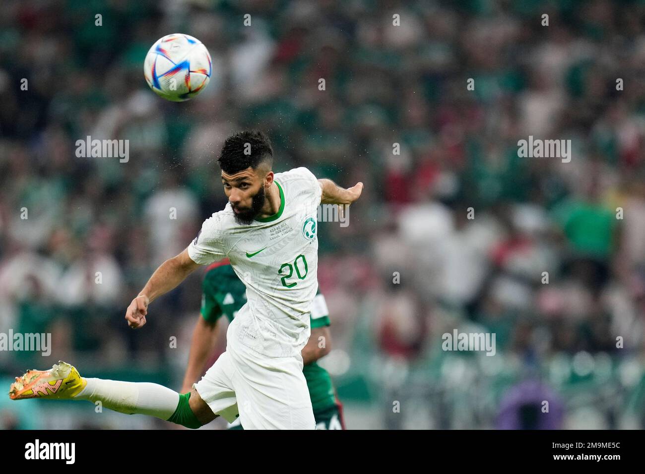 Saudi Arabia's Abdulrahman Al-Aboud heads the ball during the World Cup ...
