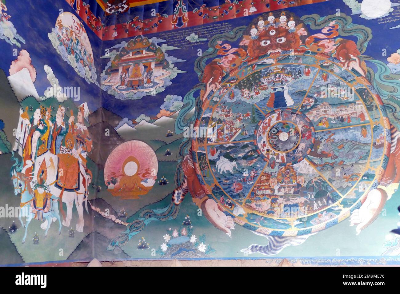 A closeup of Lord Yama holding the mandala of the circle of life and ...