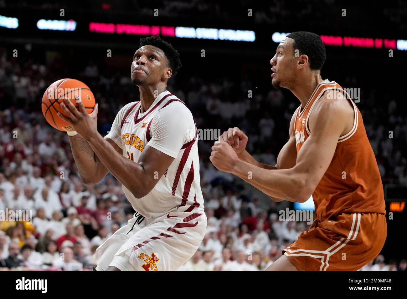 Iowa State center Osun Osunniyi drives to the basket past Texas forward ...