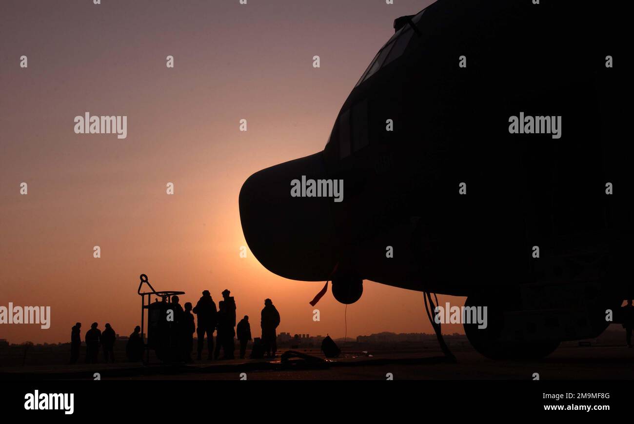 030322-F-9171L-002. [Complete] Scene Caption: As night falls at Tague ...