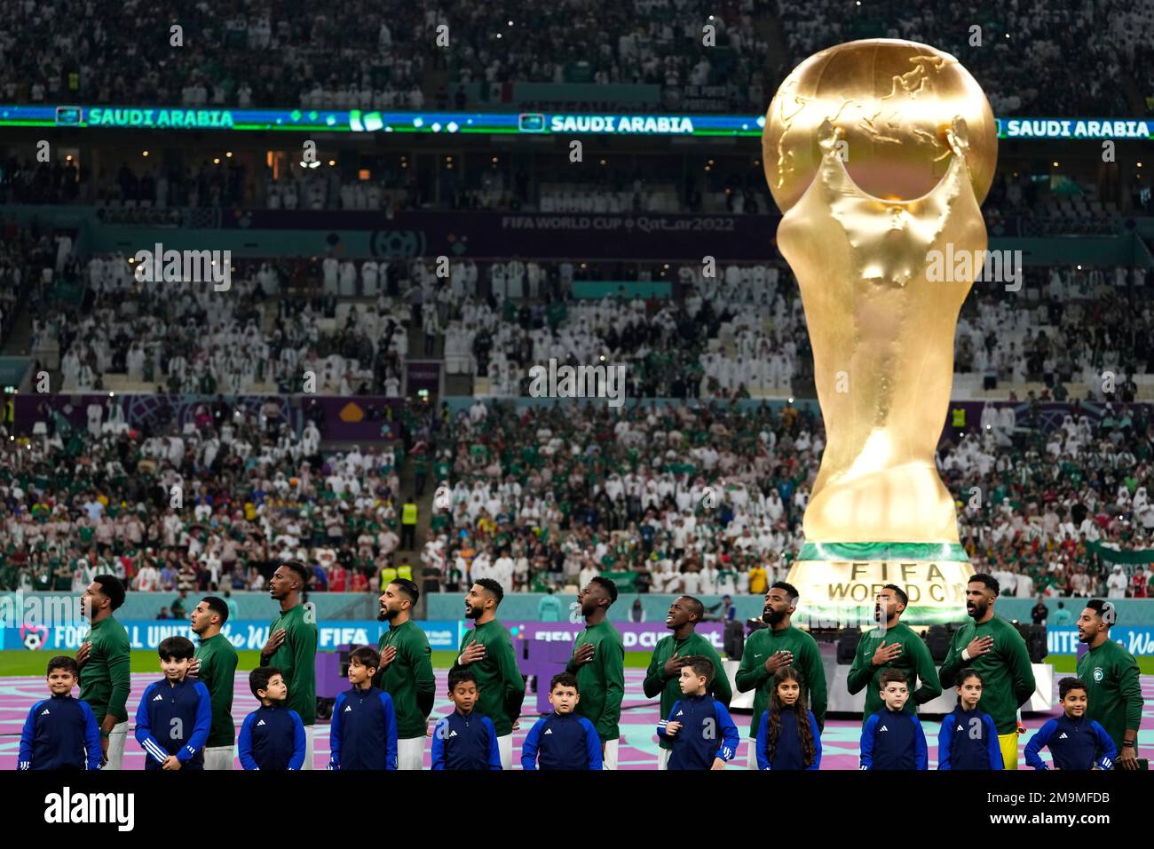 Players of Saudi Arabia line up for the World Cup group C soccer match ...