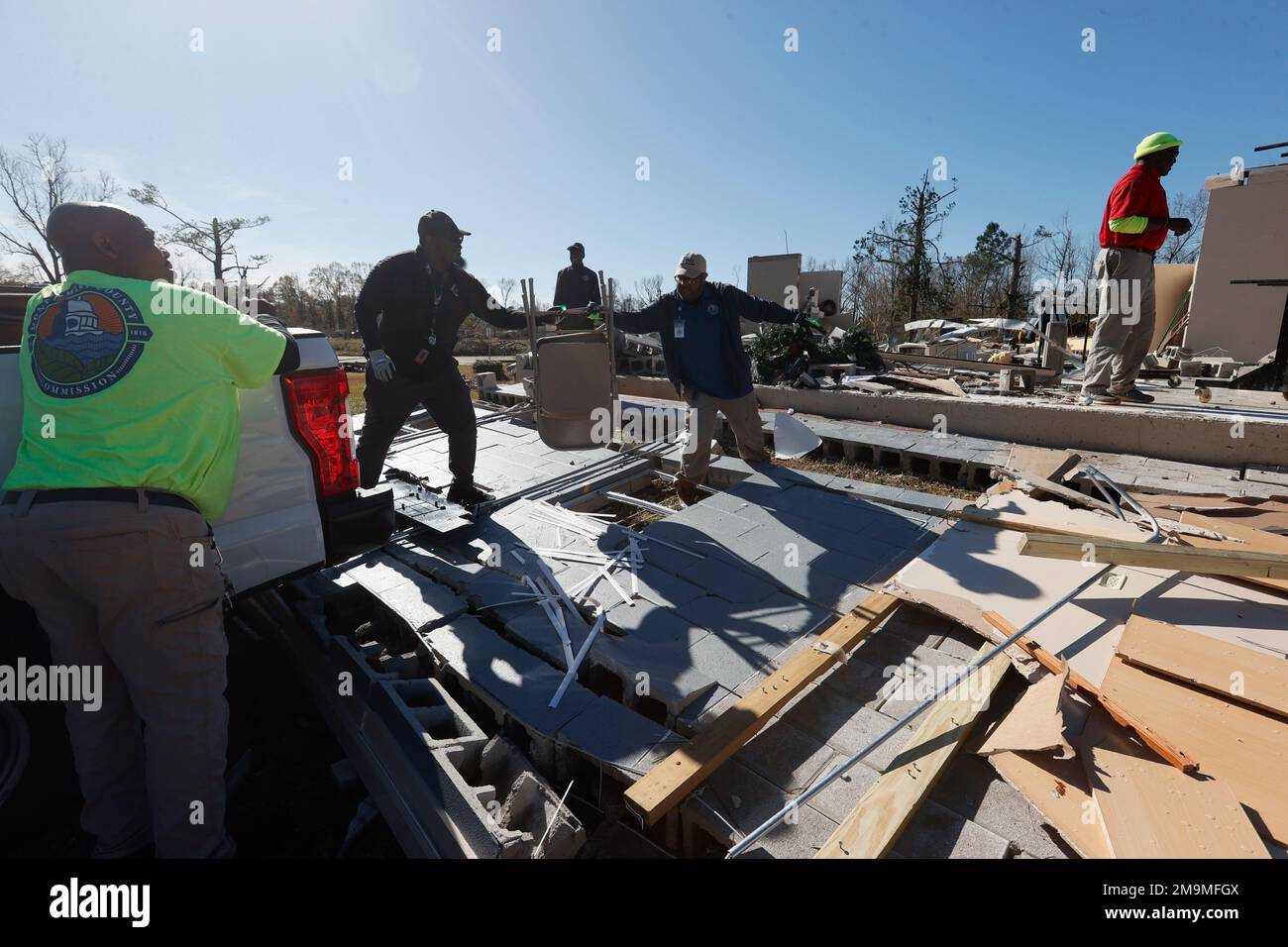Workers remove chairs from the Flatwood Community Center after a ...