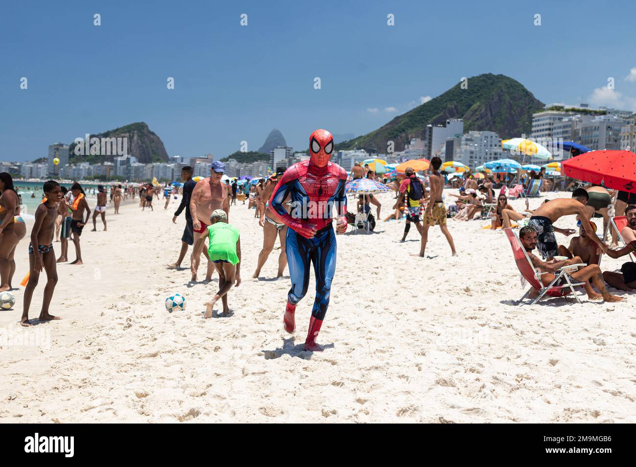 Rio De Janeiro, Brazil. 17th Jan, 2023. A man dressed as Spiderman runs on Copacabana beach in ...