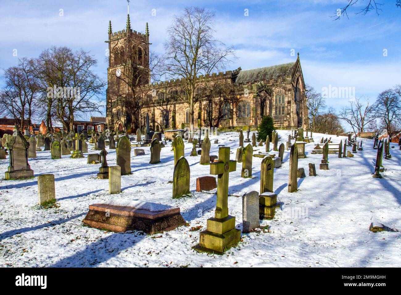 The snow covered churchyard and gravestones at St Mary's parish church ...