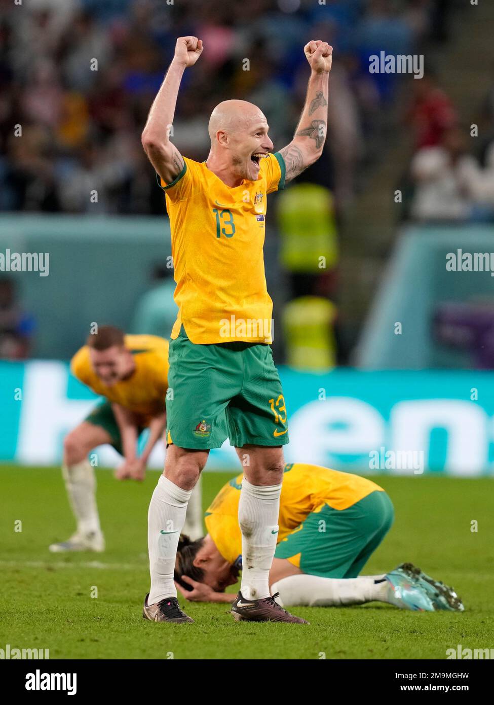 Australia's Aaron Mooy celebrates with his teammates at the end of the ...
