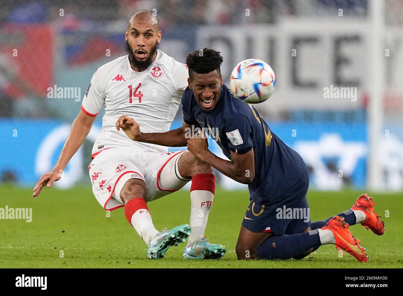 Tunisia's Aissa Laidouni, left, and France's Kingsley Coman vie for the ...