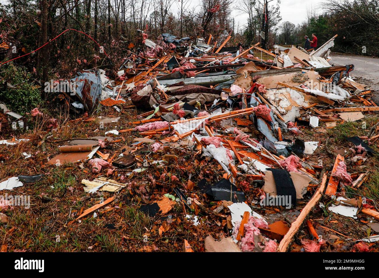 National Weather Service members survey damage from a possible tornado ...