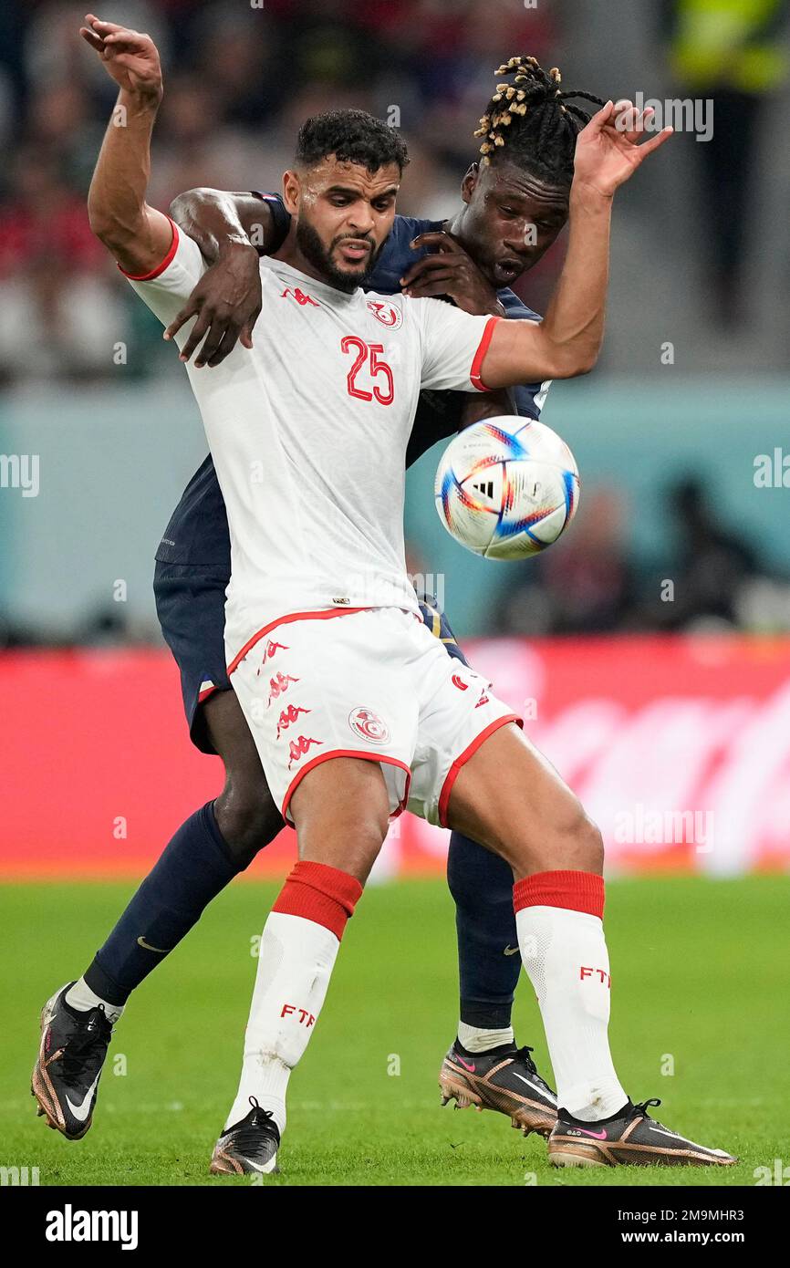 France's Eduardo Camavinga grabs Tunisia's Anis Ben Slimane during a ...