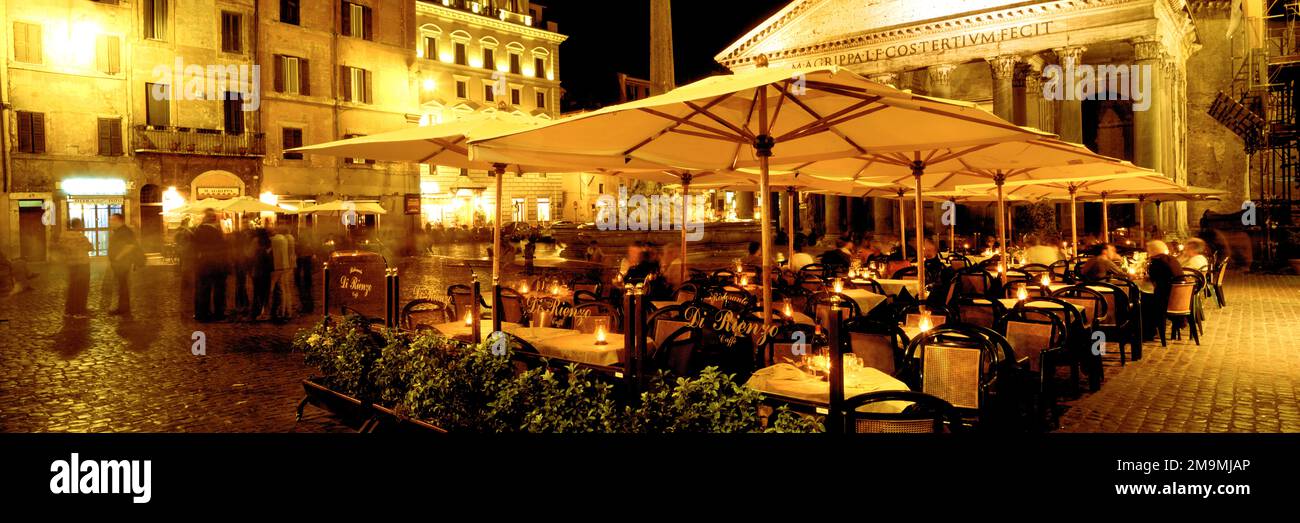 Outdoor tables of cafe on town square at night, Piazza della Rotonda ...