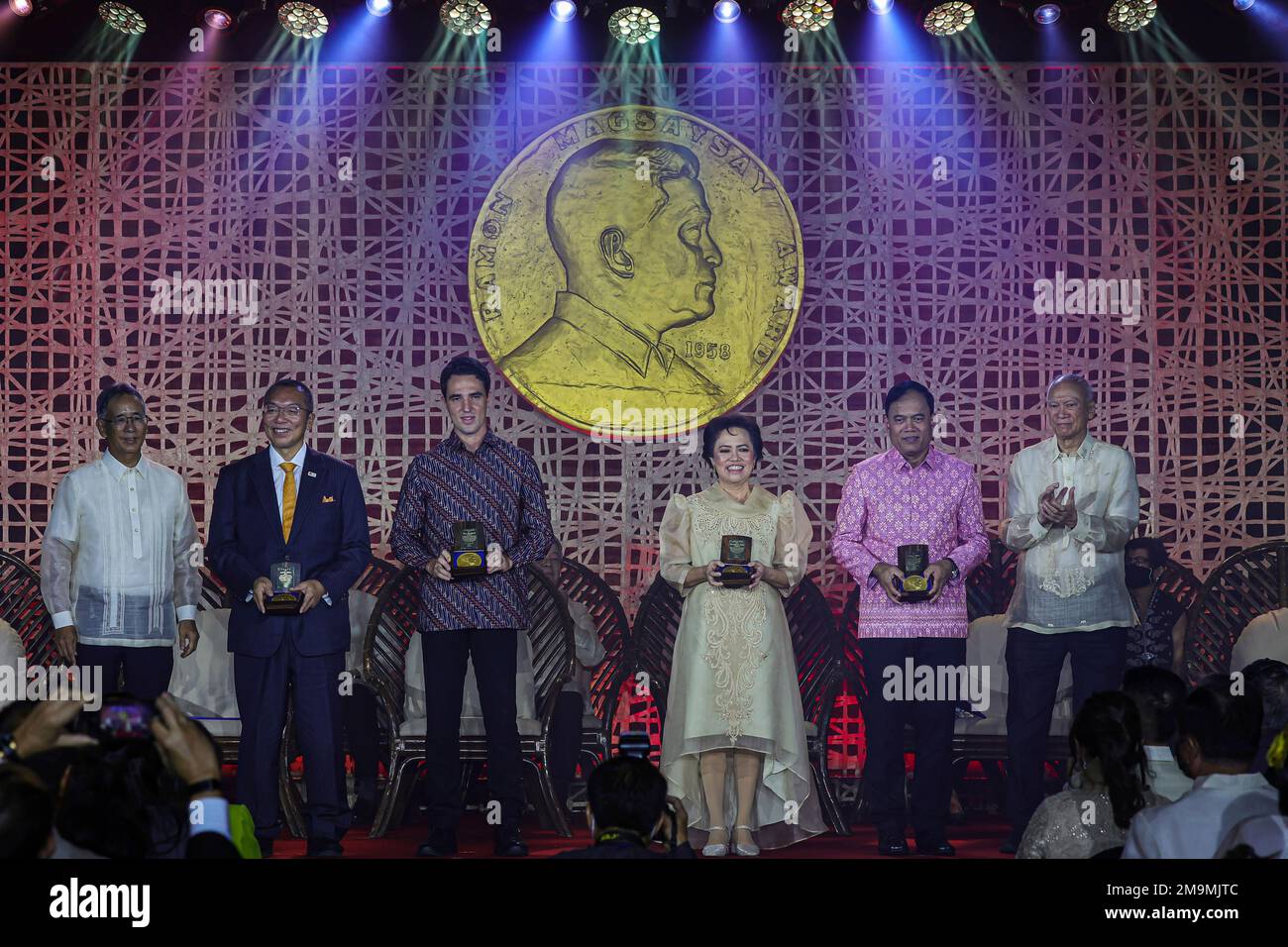 Flanked by Aurelio Montinola, left, and Ramon Magsaysay Jr., right ...