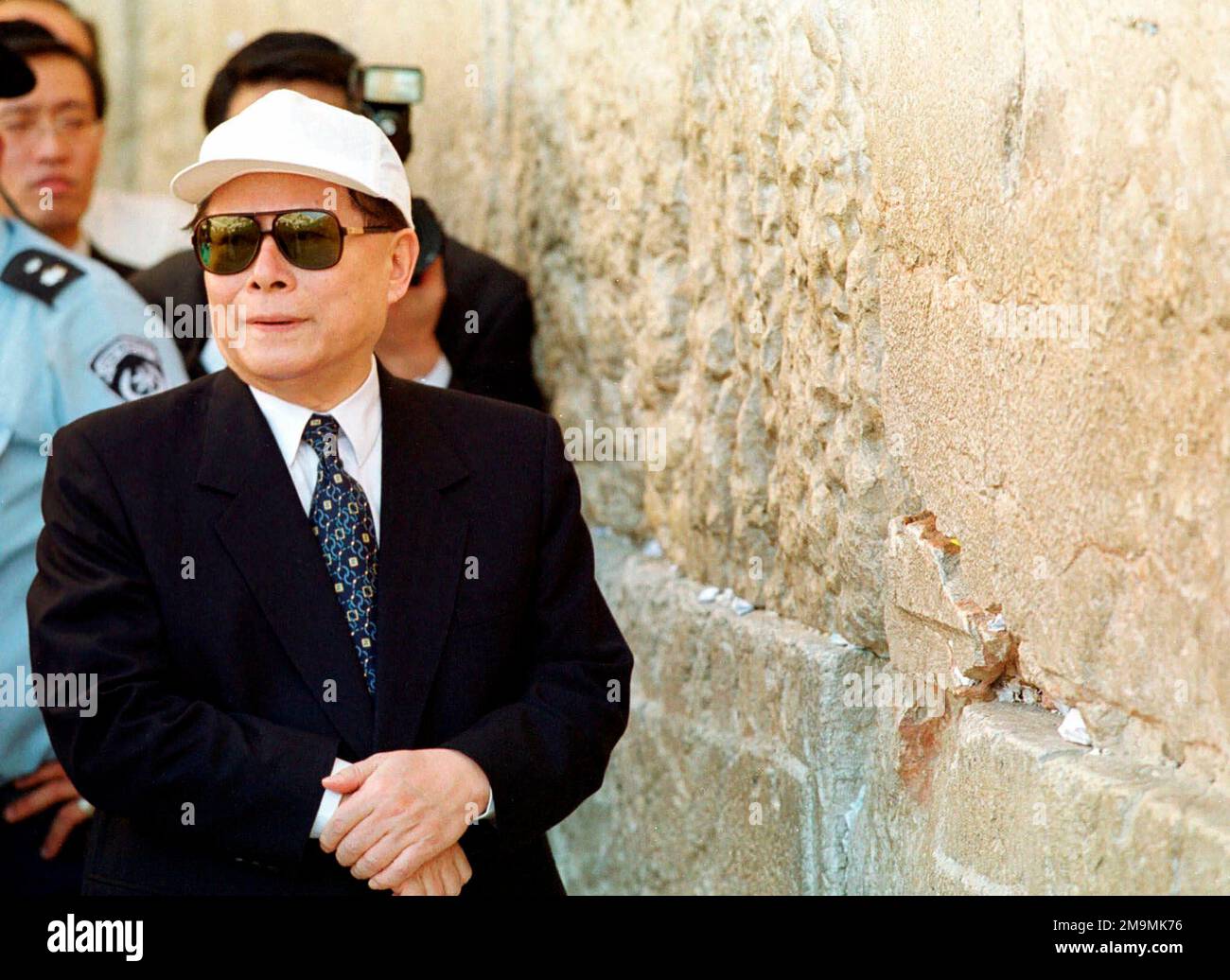 FILE - Chinese then President Jiang Zemin stands next to the Western ...