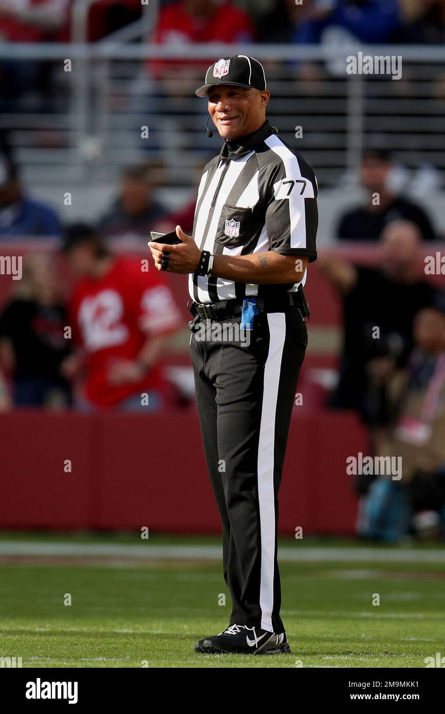 Umpire Terry Killens (77) watches during an NFL football game between ...