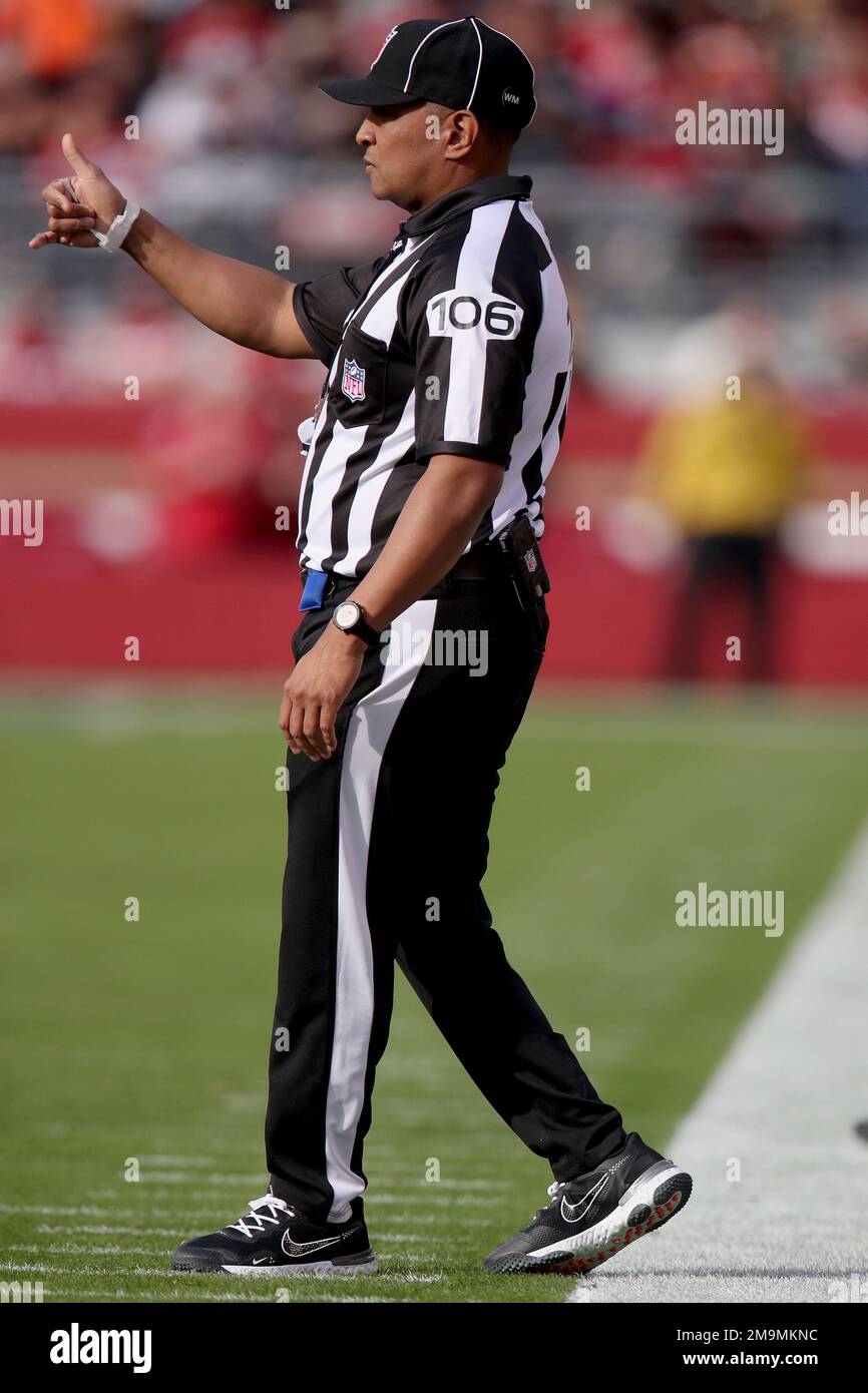 Down judge Patrick Holt (106) gestures during an NFL football game ...
