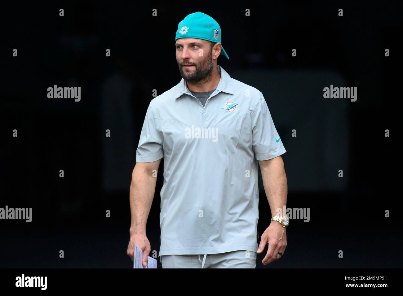 Miami Dolphins wide receivers coach Wes Welker walks onto the field ...