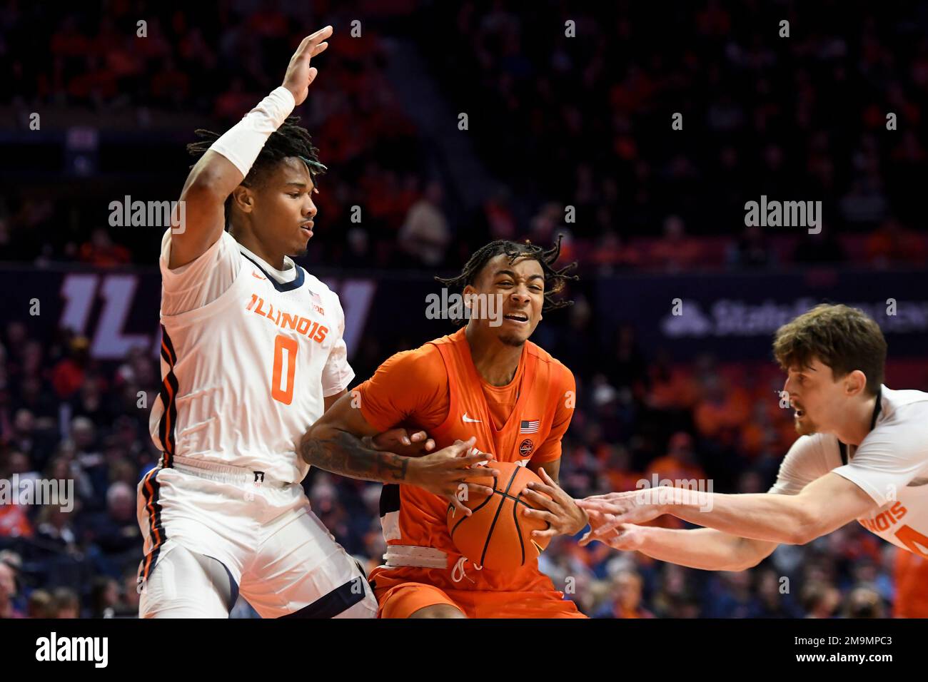 Syracuse's Judah Mintz, middle, works the ball inside against Illinois ...