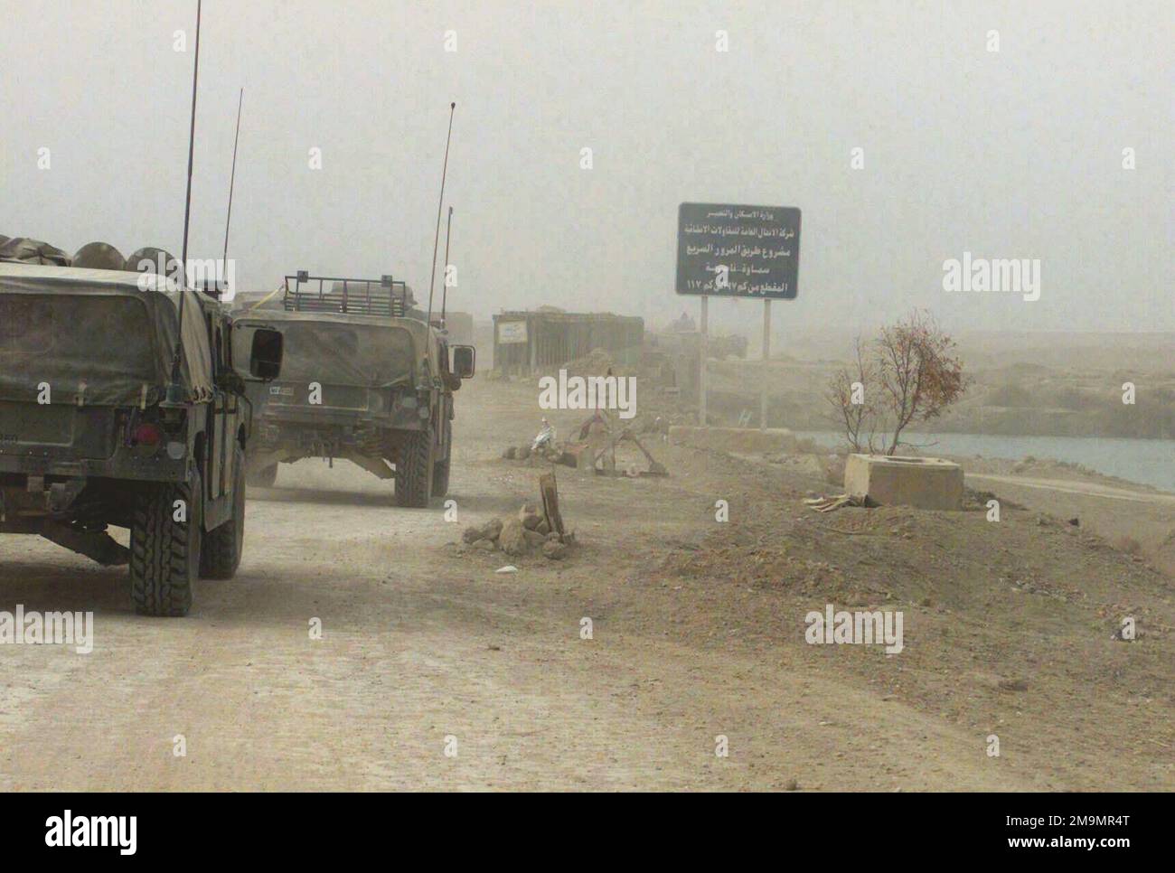 United States Marine Corps (USMC) military vehicles convoy on a road ...