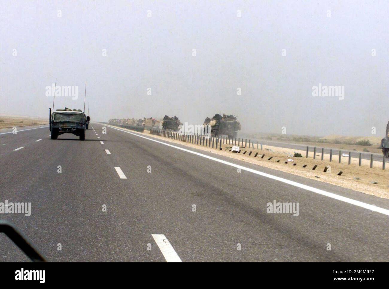United States Marine Corps (USMC) military vehicles convoy on a road ...