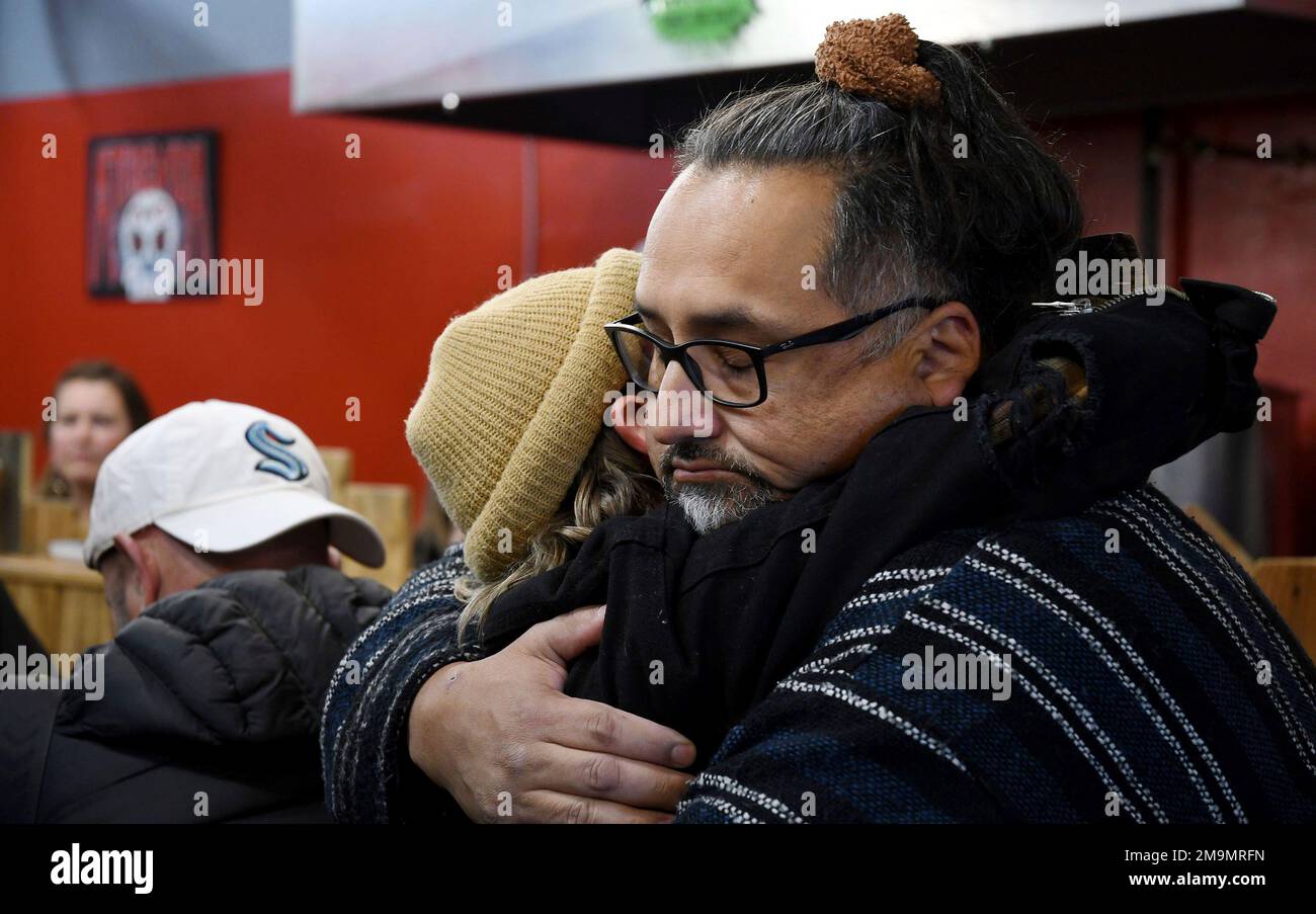 Richard Fierro, right, hugs a supporter at his brewery in Colorado ...