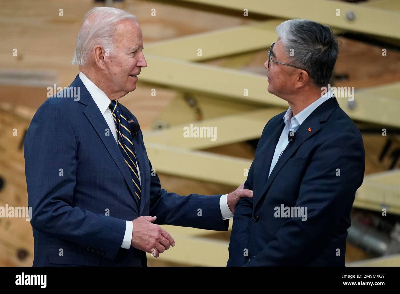President Joe Biden talks with SK Siltron CSS CEO Jianwei Dong as he ...