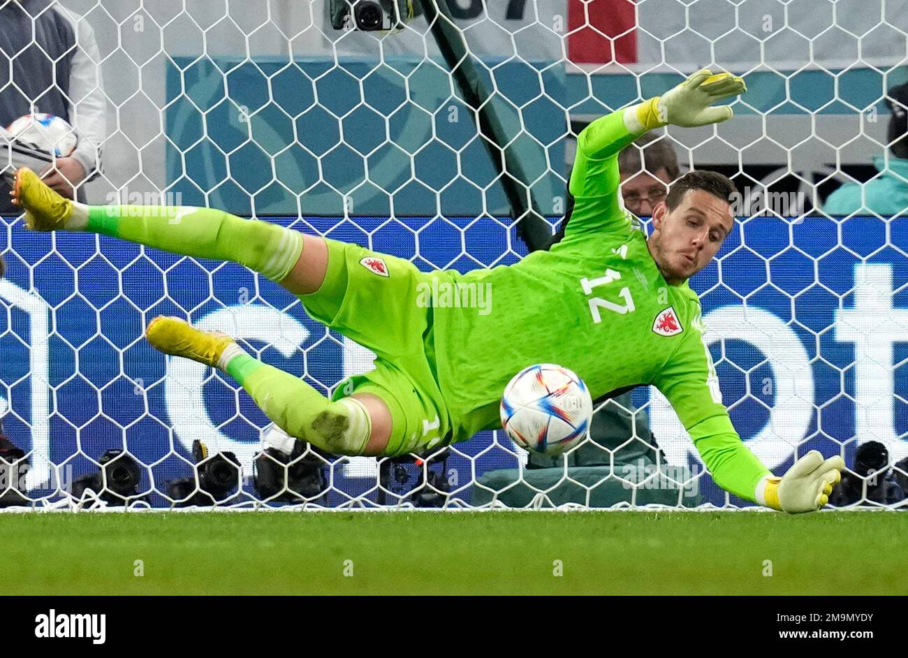 Wales' goalkeeper Danny Ward makes a save in front of England's Jude ...