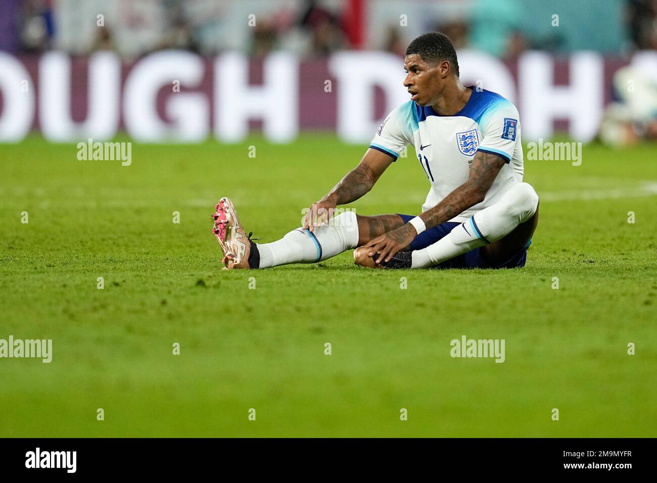 England's Marcus Rashford sits on the ground during the World Cup group ...