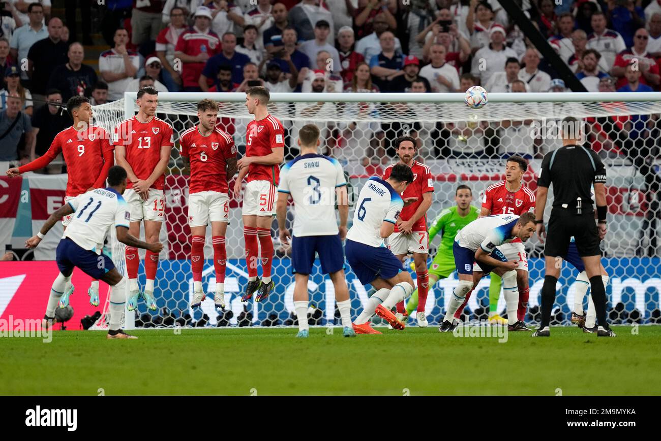 England's Marcus Rashford, front left, scores his side's opening goal ...
