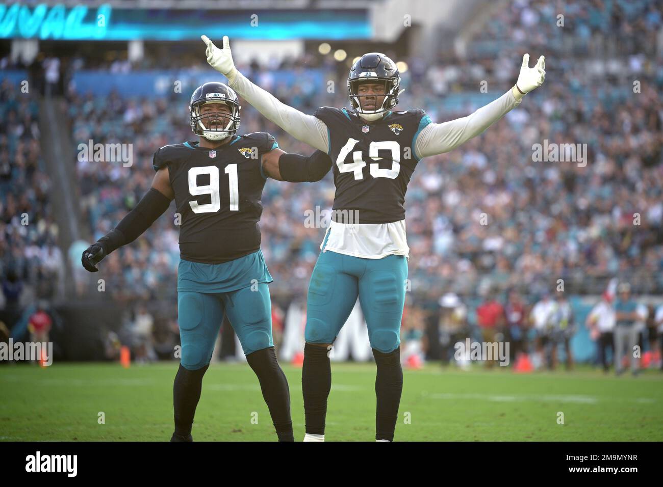 Jacksonville Jaguars defensive end Dawuane Smoot (91) and defensive end ...