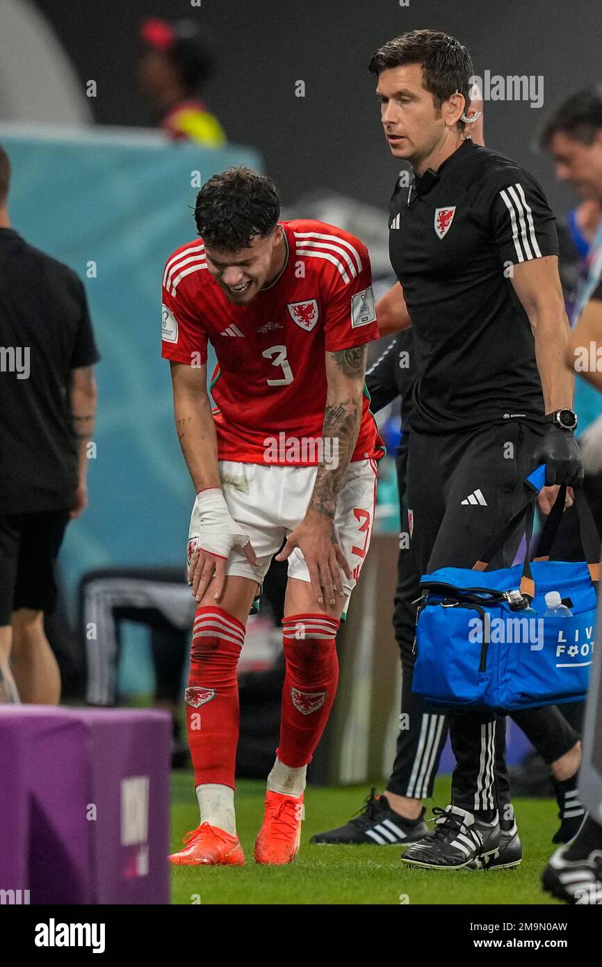 Wales' Neco Williams leaves the pitch injured during the World Cup ...